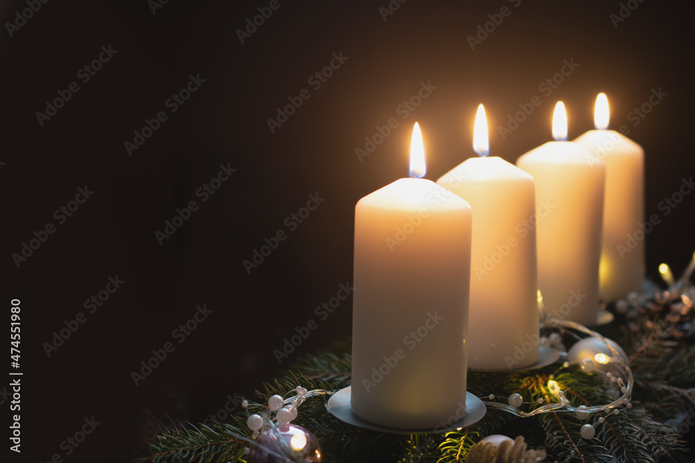 Fourth advent, four candles - candlelight on dark brown panorama ...
