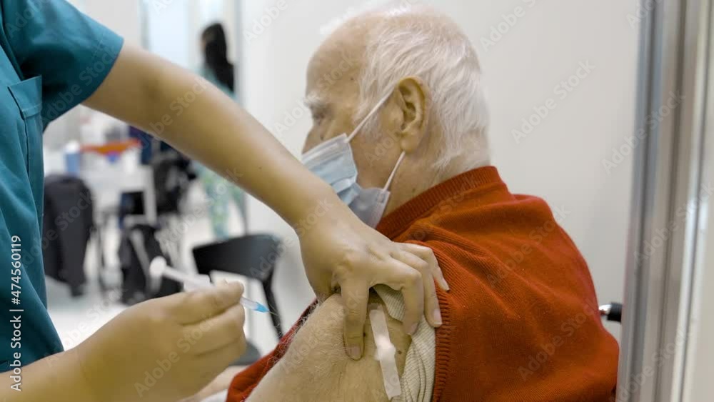 Medical Nurse in Safety Gloves and Protective Mask is Making a Vaccine ...