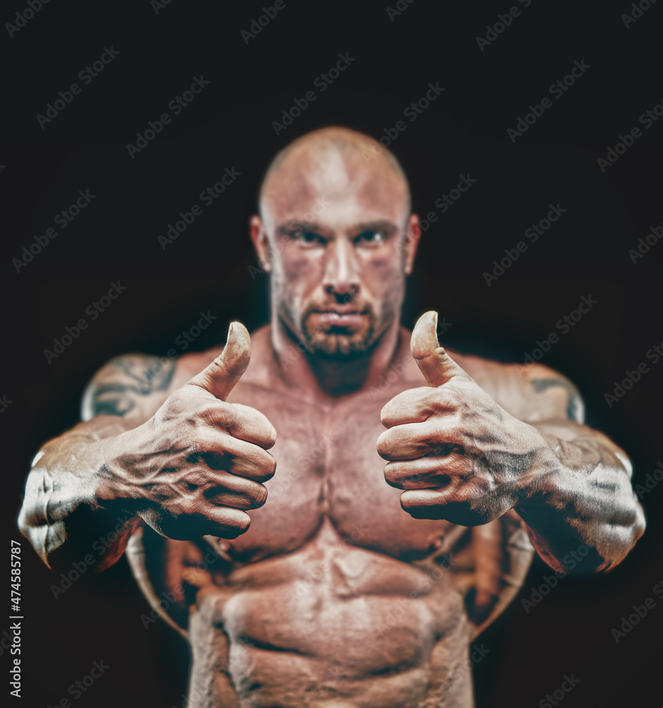 Shirtless muscular man pointing thumbs up Stock Photo | Adobe Stock