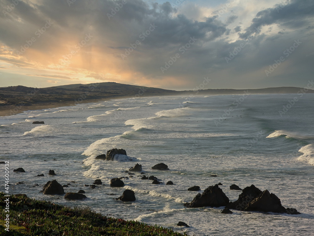 Surfers in ocean waiting for the perfect wave on the california coast ...