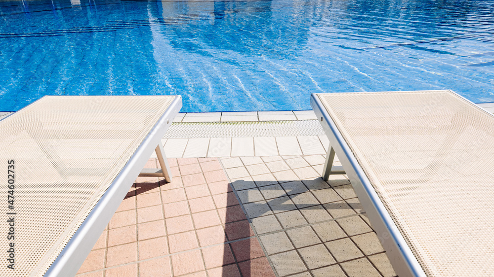 Resort pool. Summer resort chair, relax lounge at luxury hotel pool ...