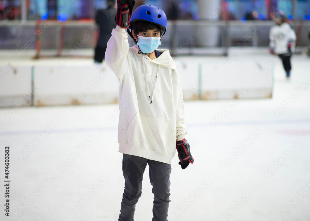 Asian teenager boy play ice skate indoor Stock Photo | Adobe Stock