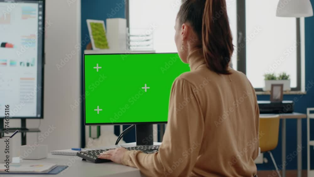 Close up of person using green screen on computer in business office ...