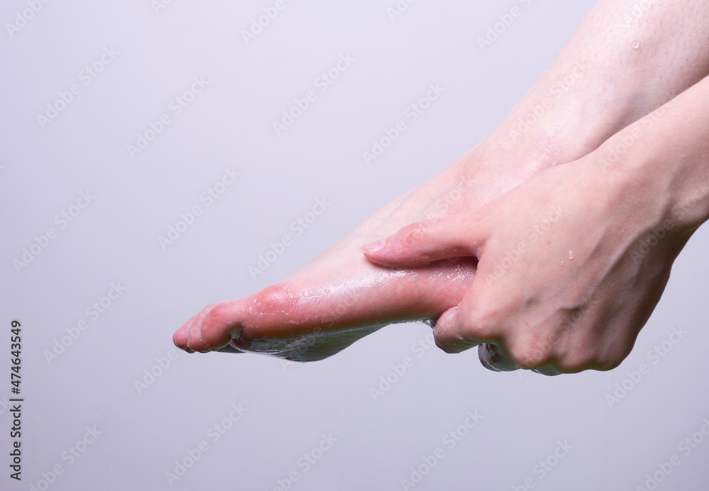 Washing your feet. Foam feet. Wash your feet with soap Stock Photo ...
