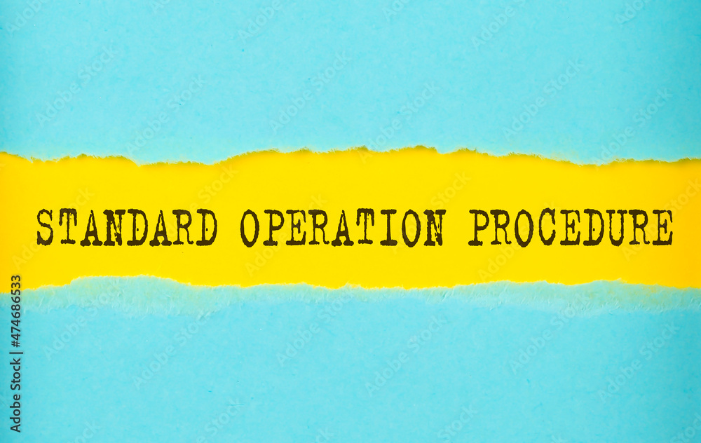 Standard Operating Procedure text on the torn paper , yellow background ...