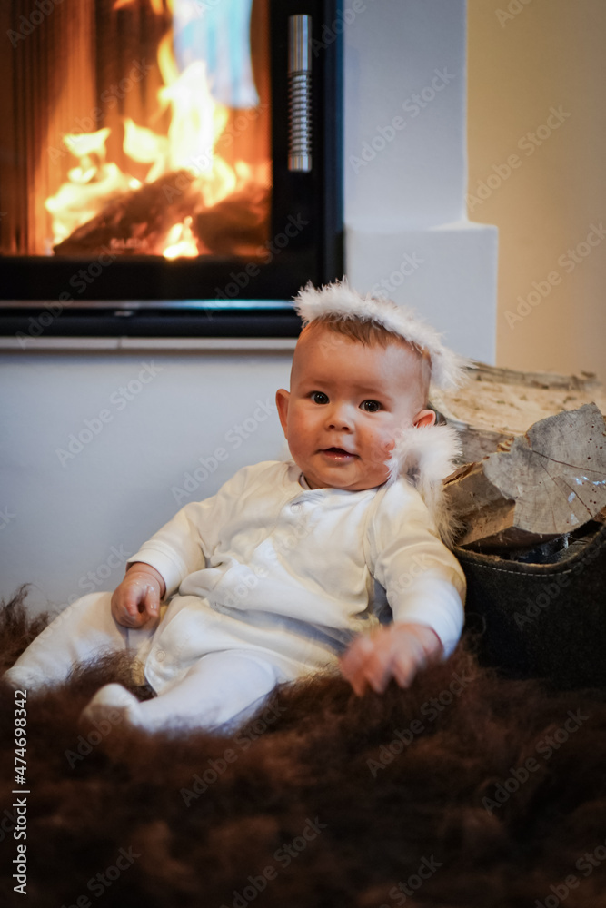 happy innocent newborn baby in white angel outfit with feather wings ...