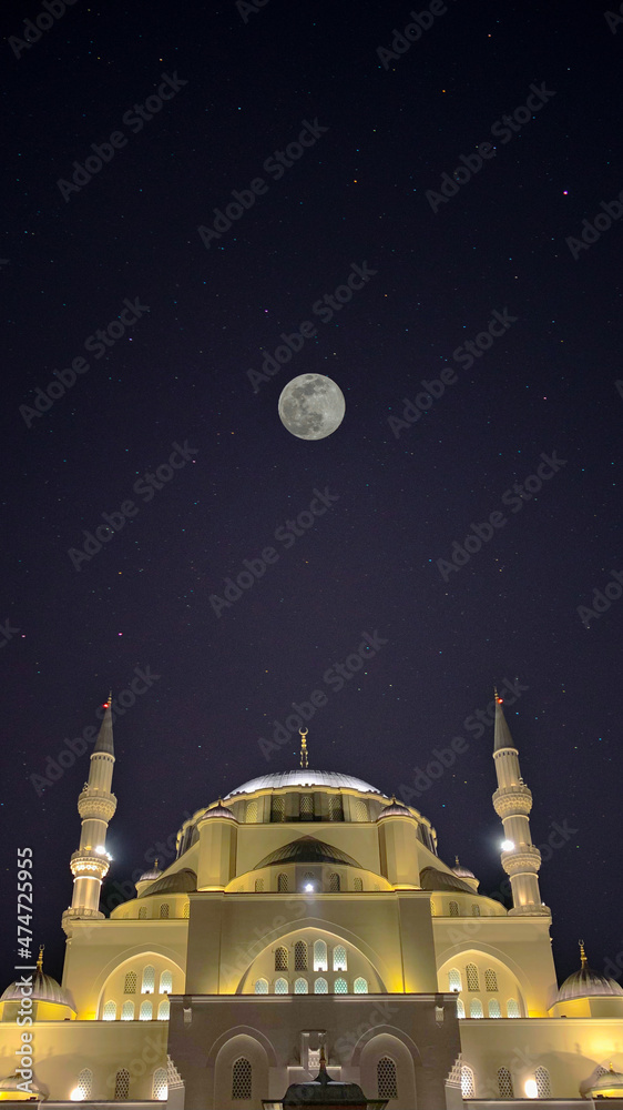 The moon over the mosque is beautiful. Stock Photo | Adobe Stock