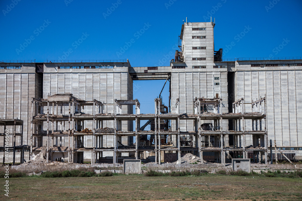 Outdated Soviet concrete grain elevator. Destroyed building structure ...