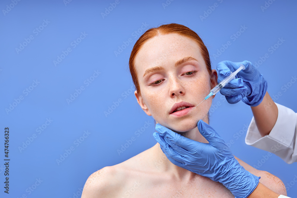 sensual female lips, procedure lip augmentation. Syringe near womans ...