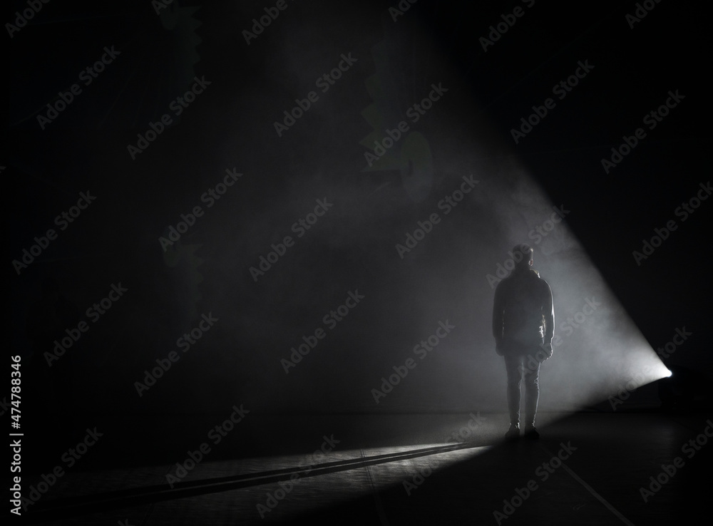 Silhouette of a spooky man standing in shadows Stock Photo | Adobe Stock