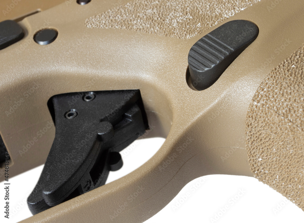 Magazine release on a semi-auto handgun Stock Photo | Adobe Stock