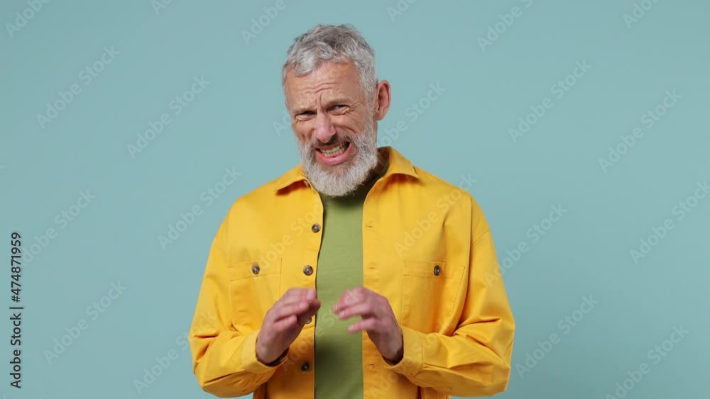Scared shocked elderly gray-haired bearded man 50s wears yellow shirt ...