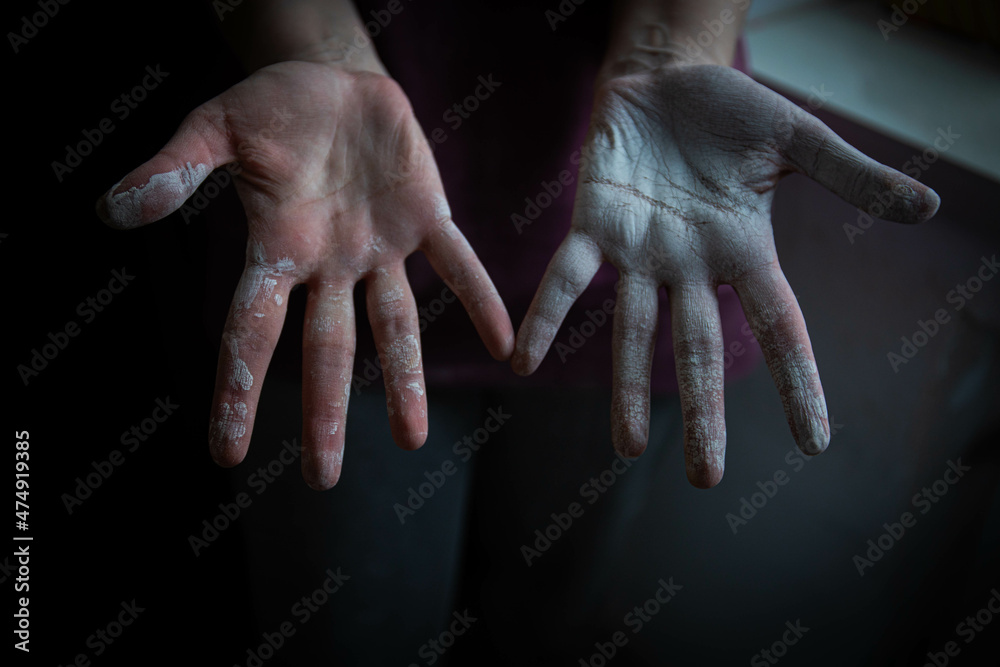 beautiful women's hands smeared in white paint after working with their ...