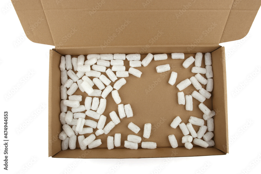 Styrofoam packing peanuts in cardboard box isolated in on white ...