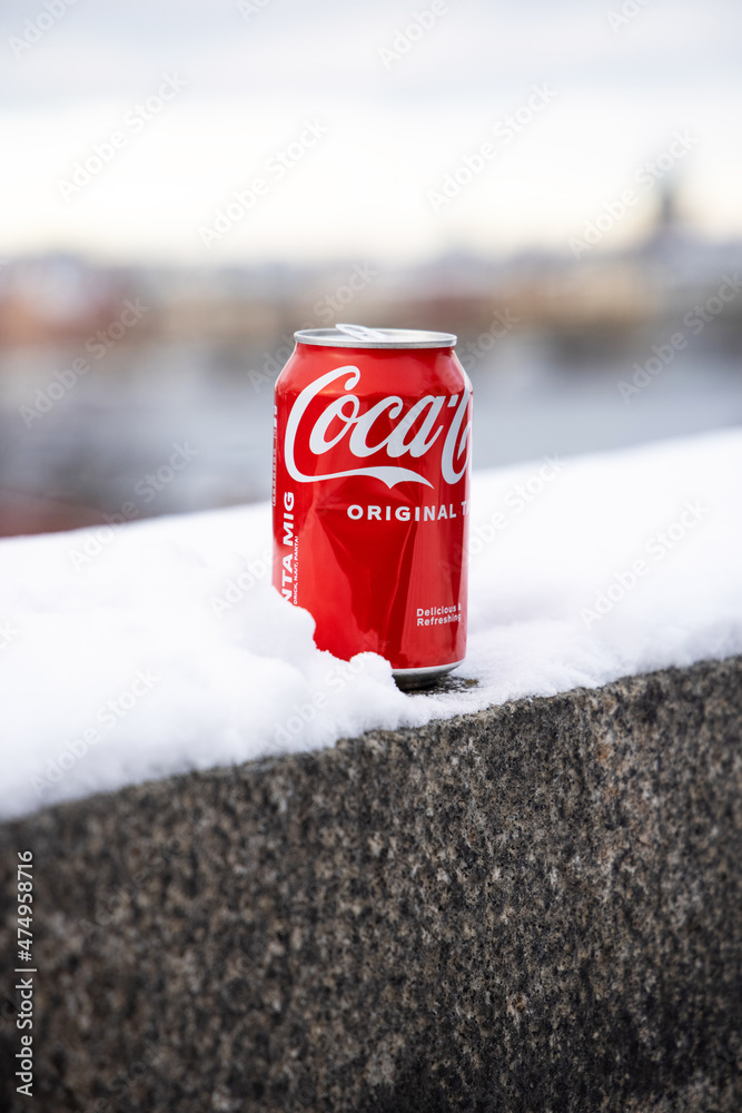Coca cola can left in the city on the snow. Coca-cola is one of the ...