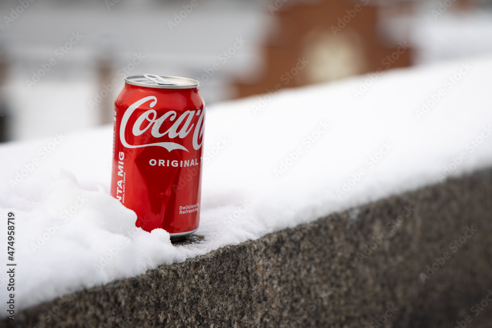 Coca cola can left in the city on the snow. Coca-cola is one of the ...