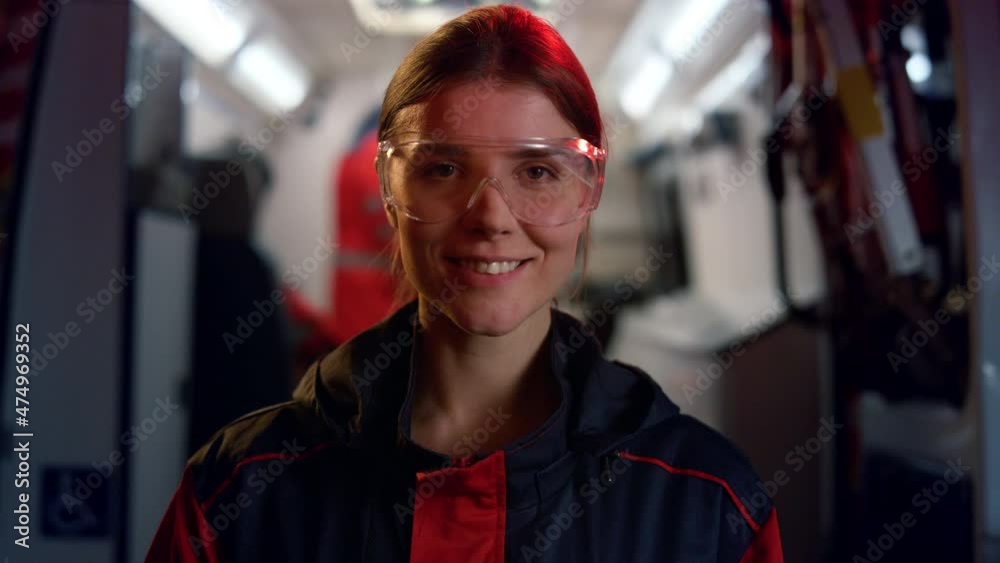 Paramedic posing at camera against emergency car. Doctor standing on ...