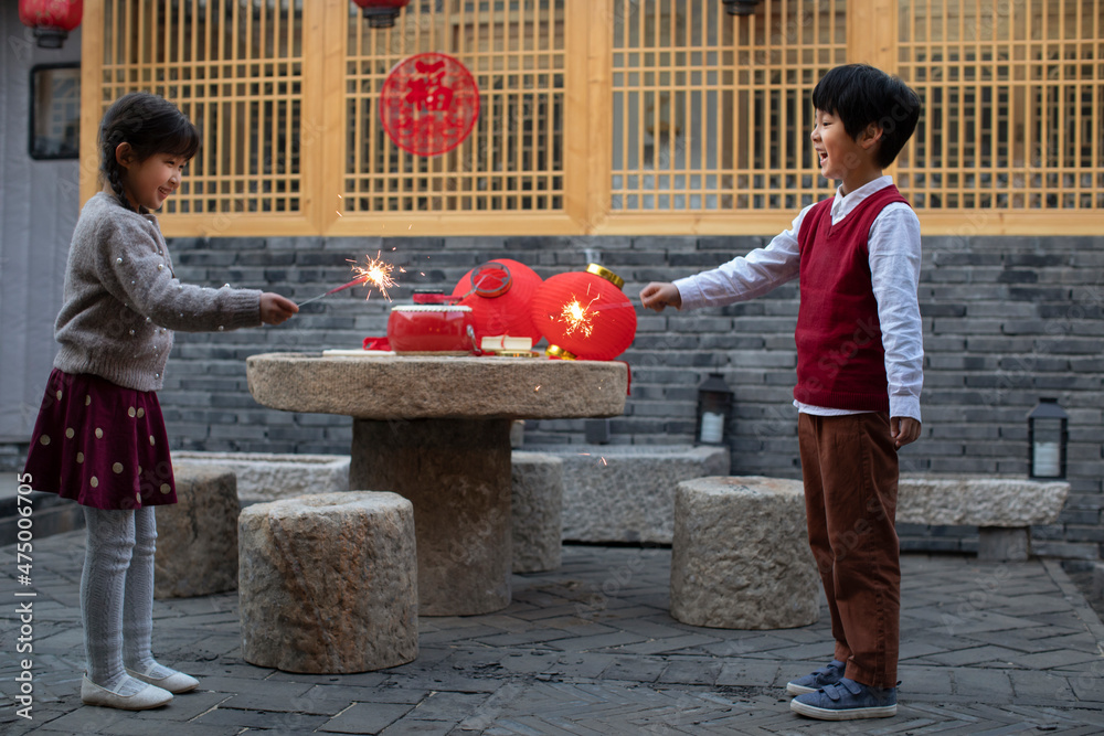 Happy children celebrating Chinese new year Stock Photo | Adobe Stock