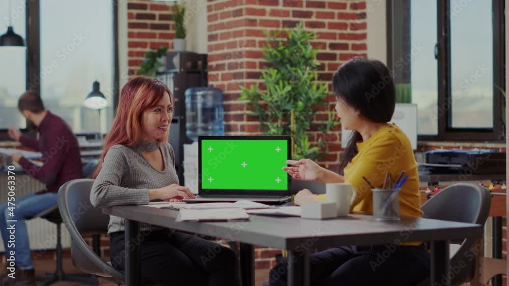 Asian women analyzing green screen on computer in office, working with ...