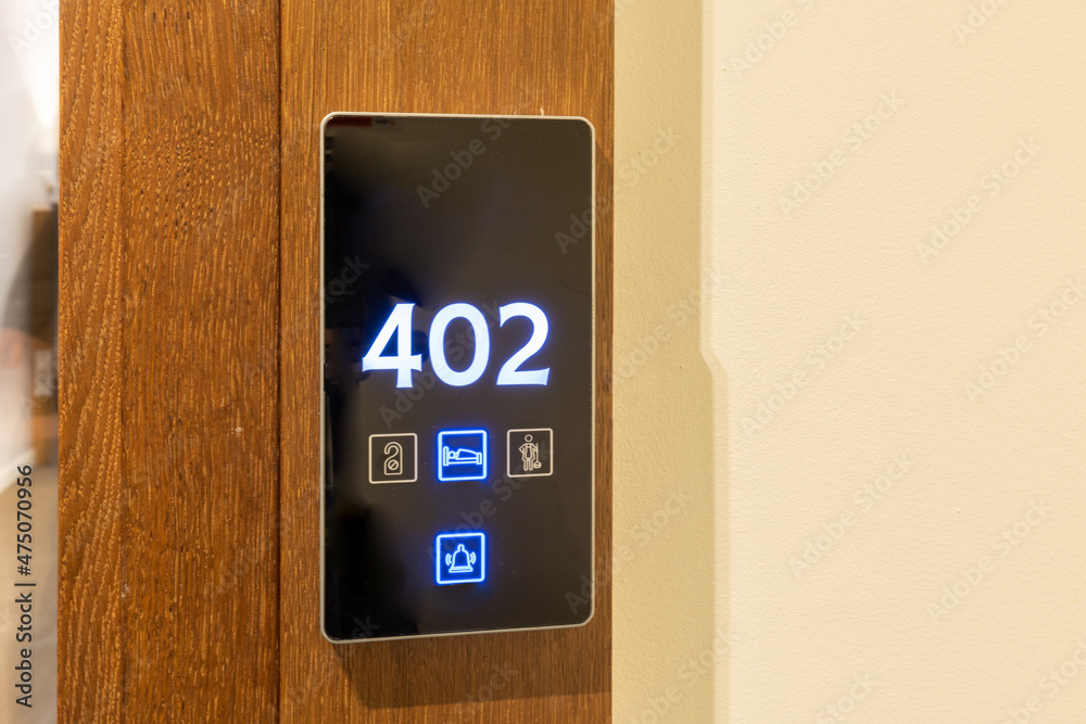 Hotel room number mounted on a wall Stock Photo | Adobe Stock