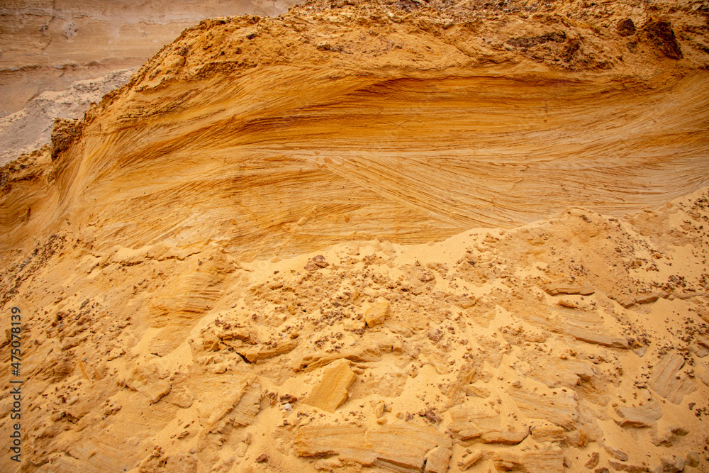 Textural sand, with relief surface, multi-colored layers and different ...