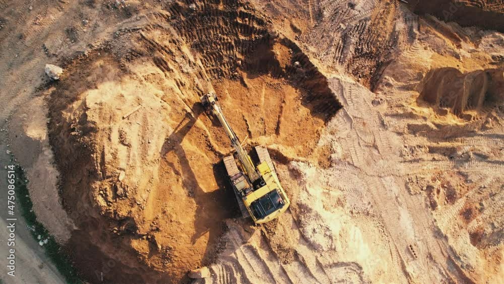 Excavator dig ground at construction site. Foundation pit for a multi ...