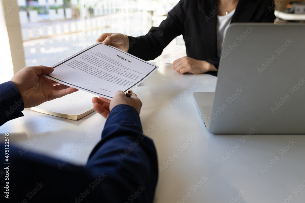 Managers receive resumes from new employees during interviews. Stock ...