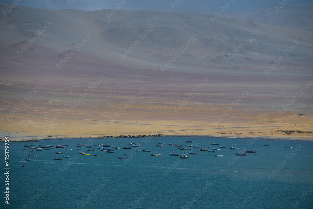 Coastal fishing village in pacific ocean bay cove turquoise water peru ...