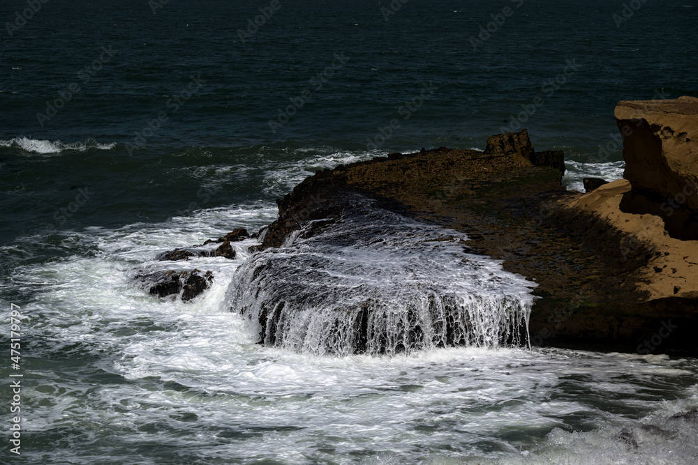 Waves crashing on coastal cliffs at paracas natural reserve in peru ...