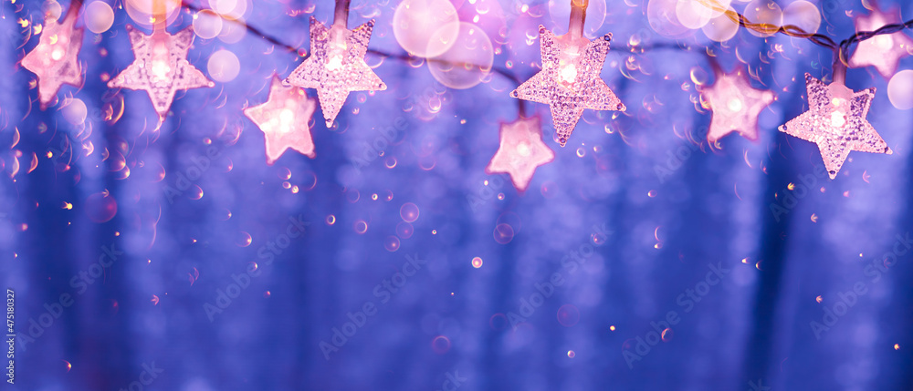 String lights in the shape of stars with bokeh lights on a shiny ...