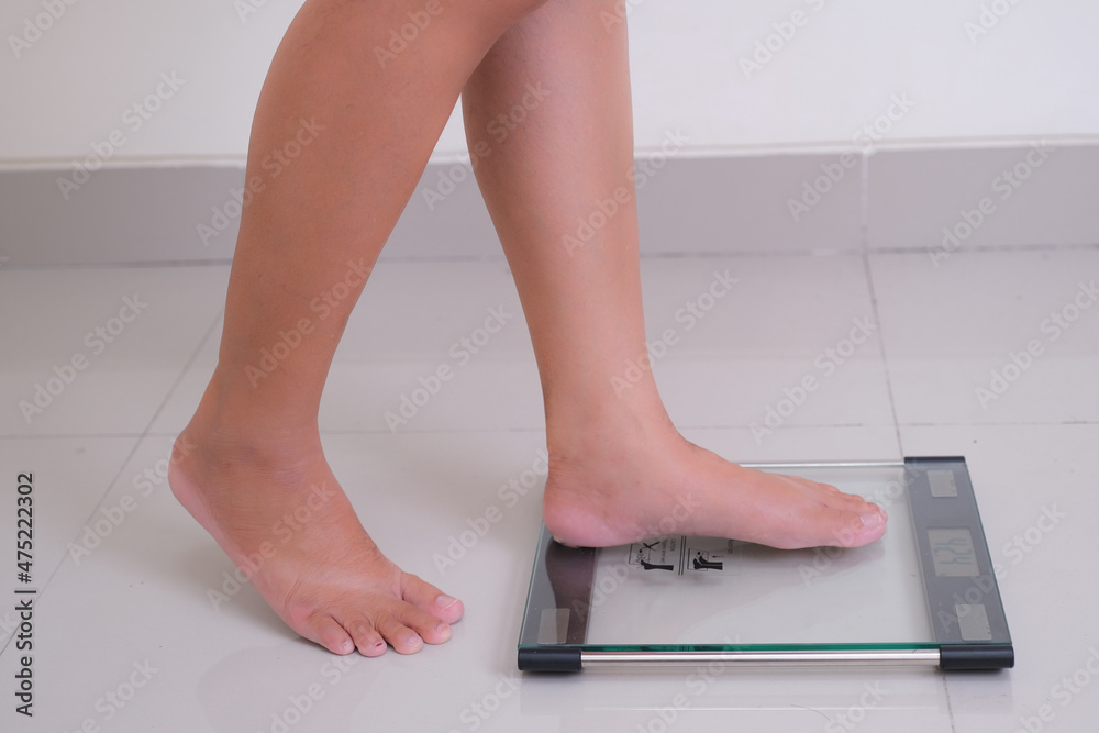feet on scales Stock Photo | Adobe Stock