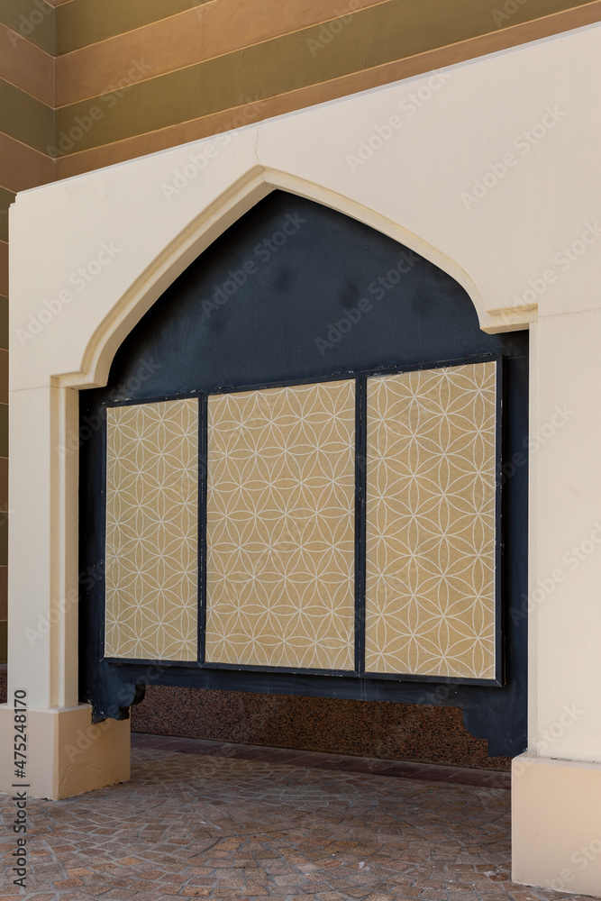 Vertical shot of a typical building with a gate in Pearl-Qatar, Doha ...