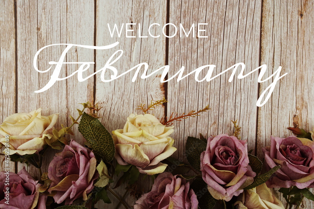 Welcome February typography text with rose flowers bouquet on wooden ...