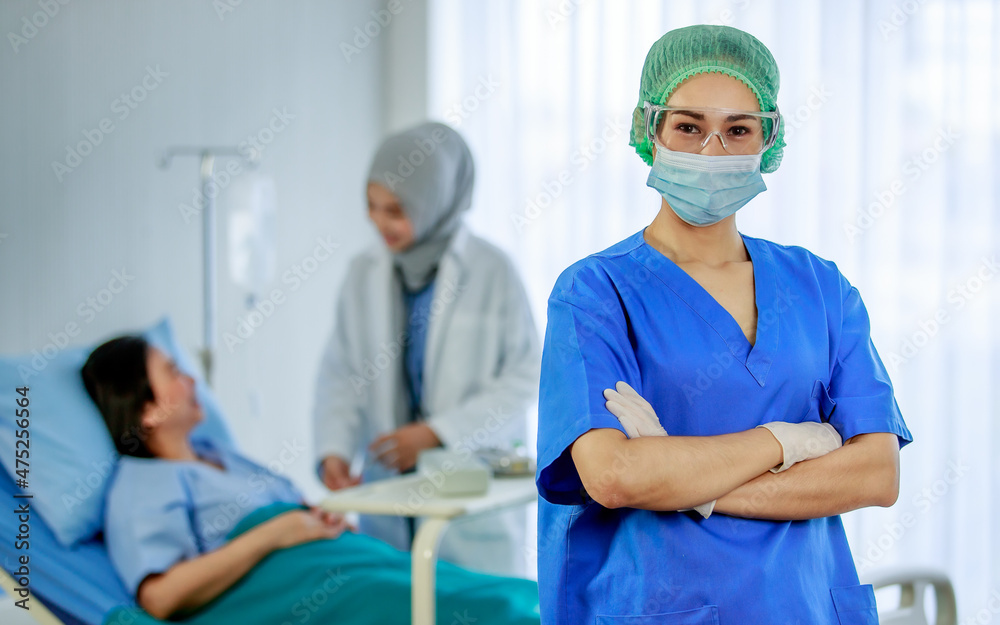 Portrait closeup shot Asian professional female nurse in blue hospital ...
