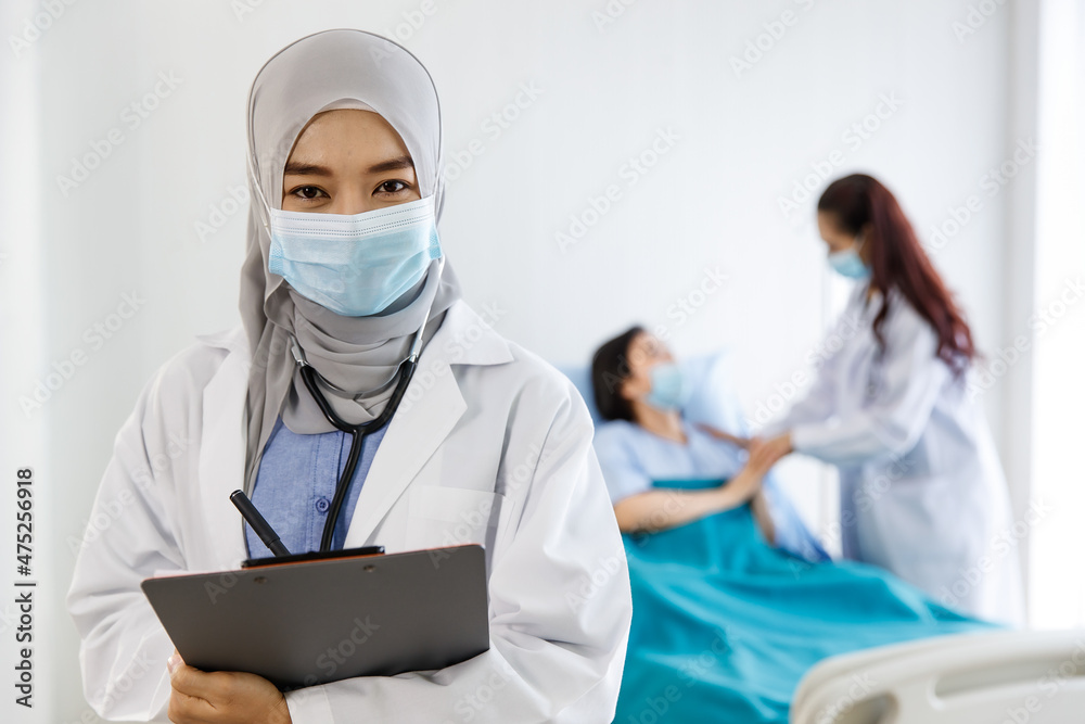 Portrait closeup shot of Muslim Arab Islam female doctor in white lab ...
