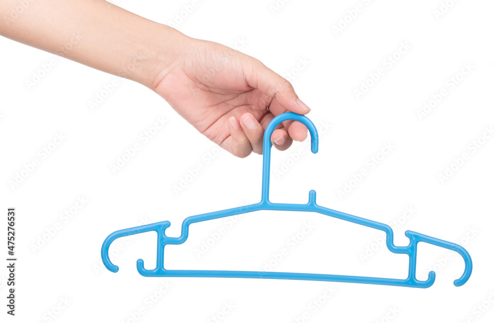 Hand holding Blue plastic clothes hangers isolated on white background ...