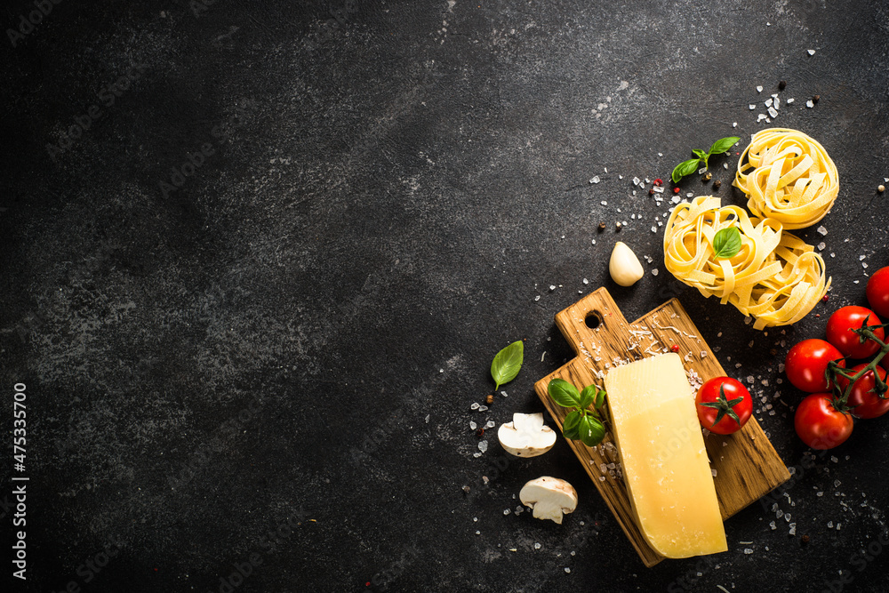 Pasta ingredients on black background. Italian food background. Pasta ...