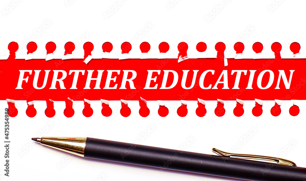 Pen and white torn paper strip on a bright red background with the text ...