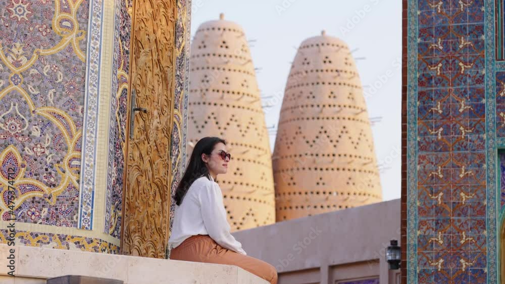 tourist woman sitted at Blue mosque of Katara village made of colorful ...