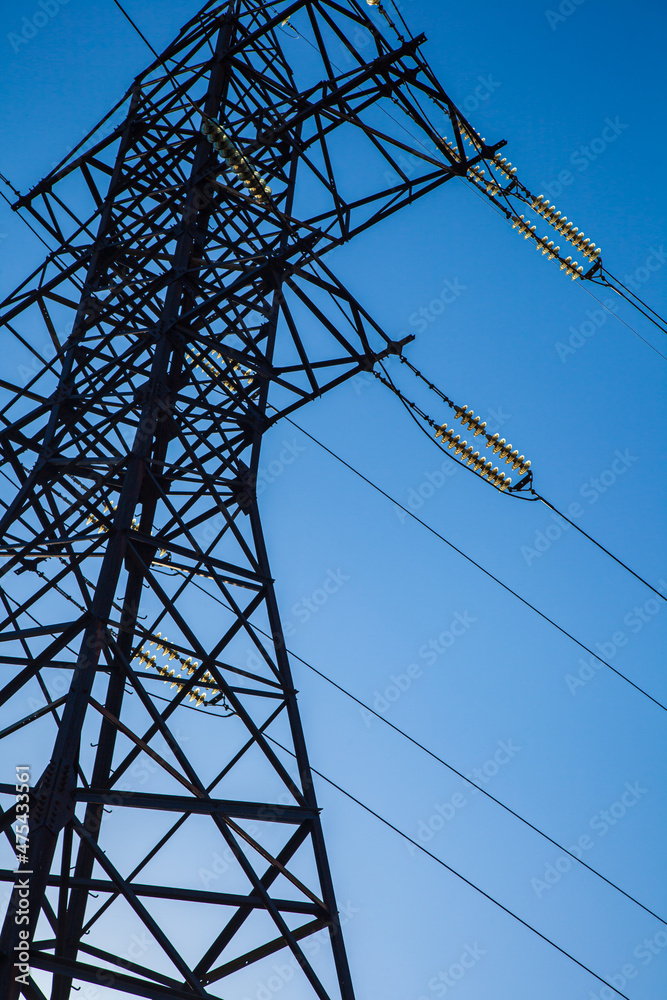 Steel tower for overhead power line. The silhouette of a power ...
