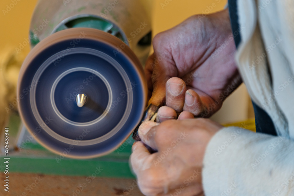 Artisan polishing muskox bone to make craft, Sisimiut, Greenland Stock ...