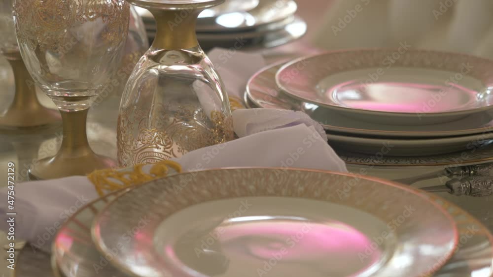 Wedding Reception Table With Porcelain Plates, Silverware, And Etched ...
