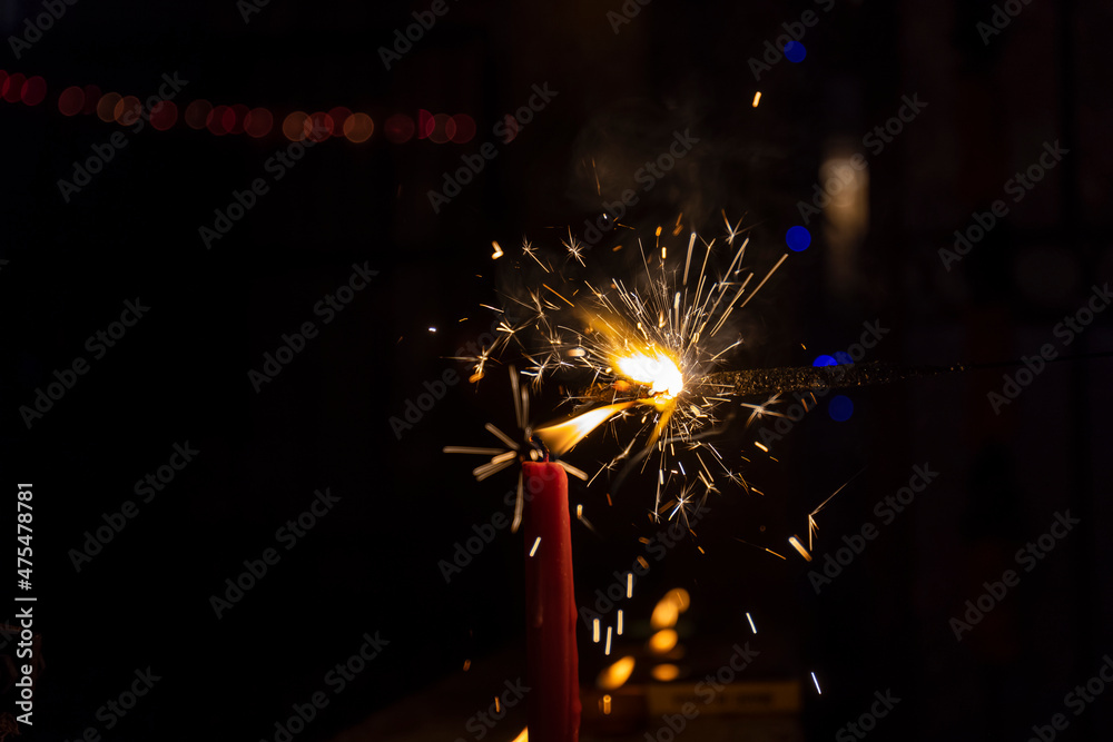 Sparkler or Fuljhadi in hand with dark black background to celebrate ...
