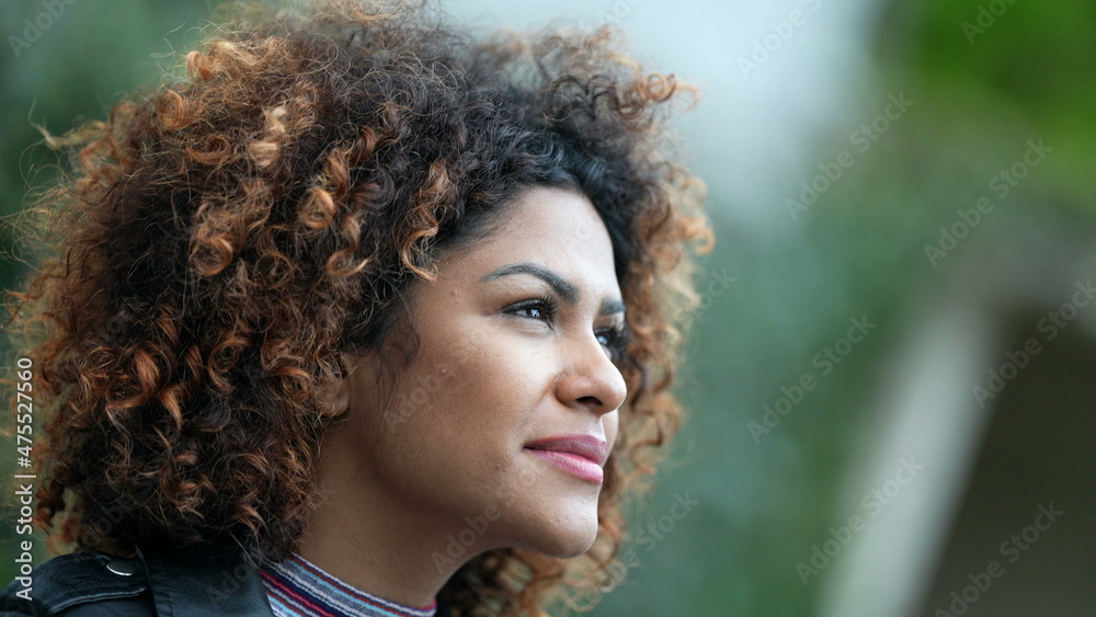 Woman face opening eyes in meditation and contemplation looking up at ...