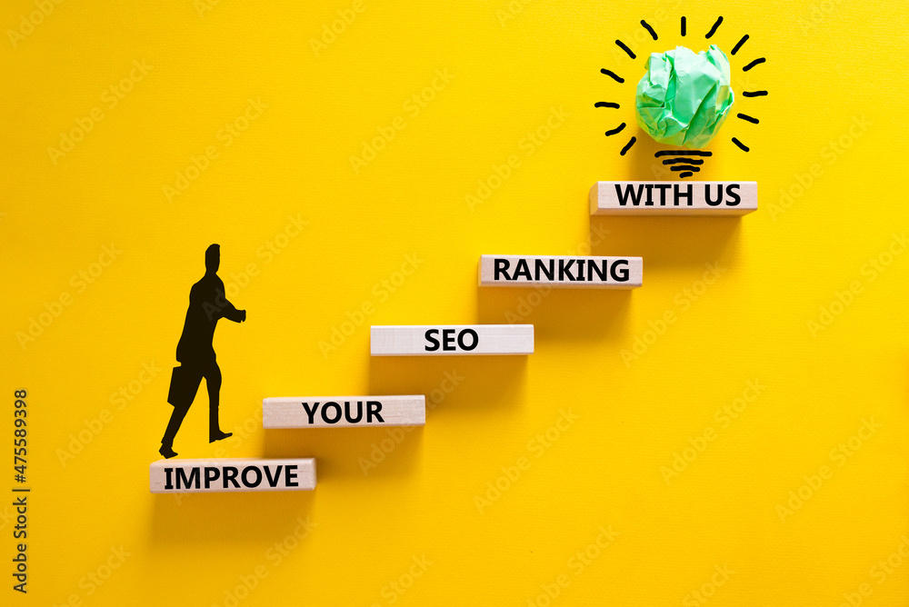 Improve your SEO ranking with us symbol. Wooden blocks with words ...
