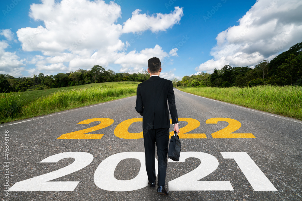 The 2022 New Year journey and future vision concept . Businessman ...