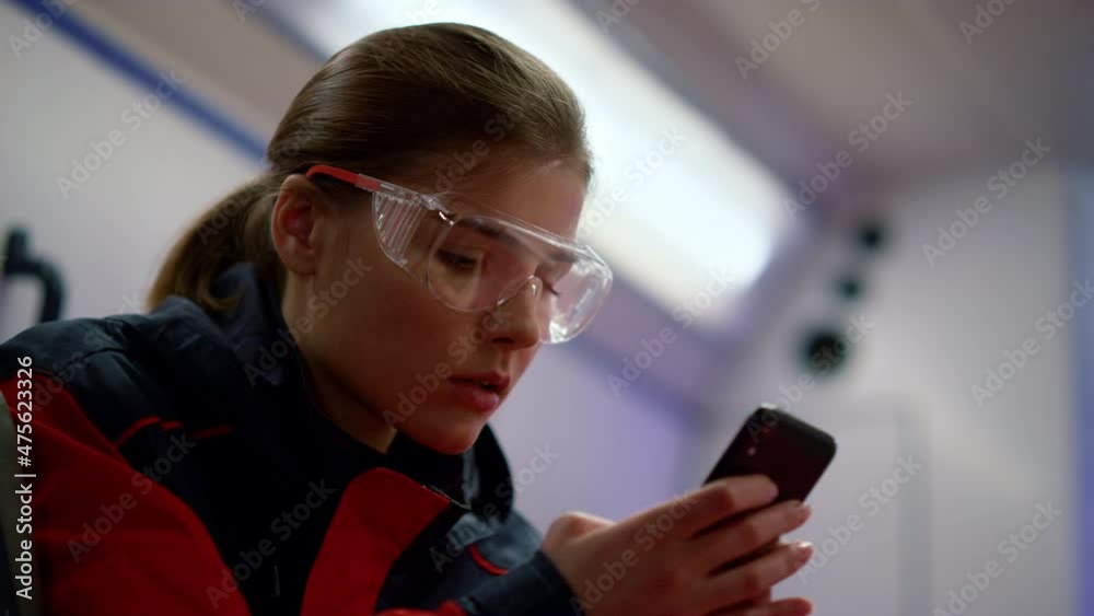 Paramedic ambulance texting message on mobile phone in emergency car ...