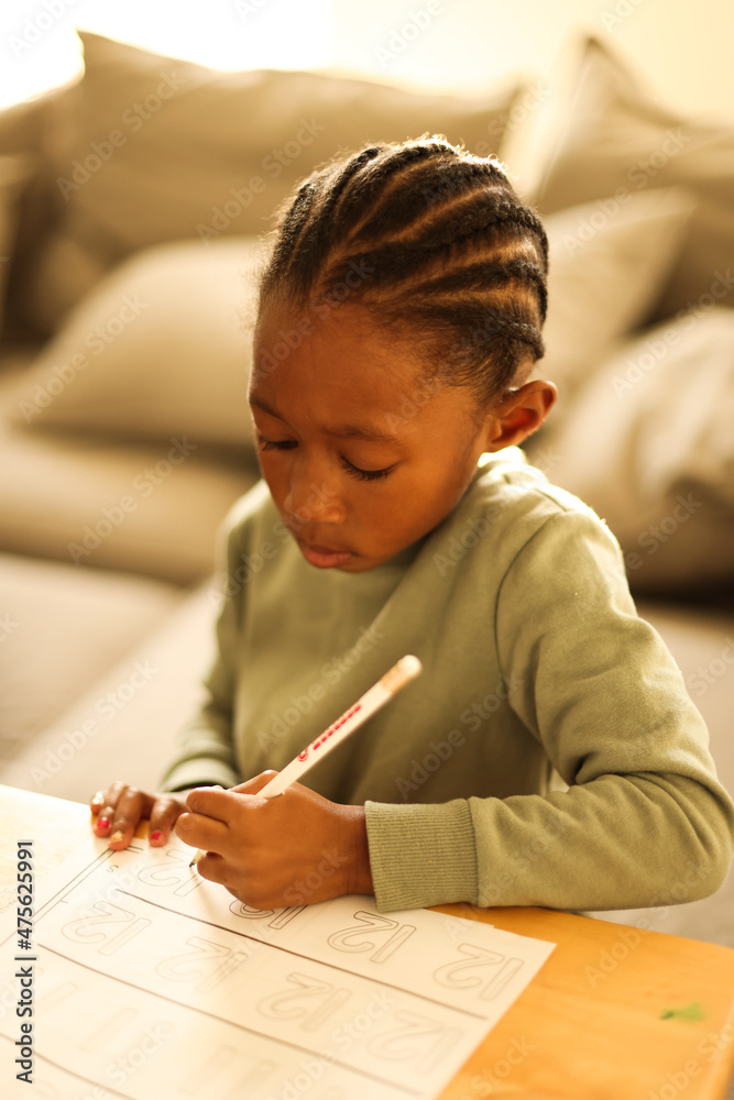 Black Girl Doing Homework Stock Photo | Adobe Stock