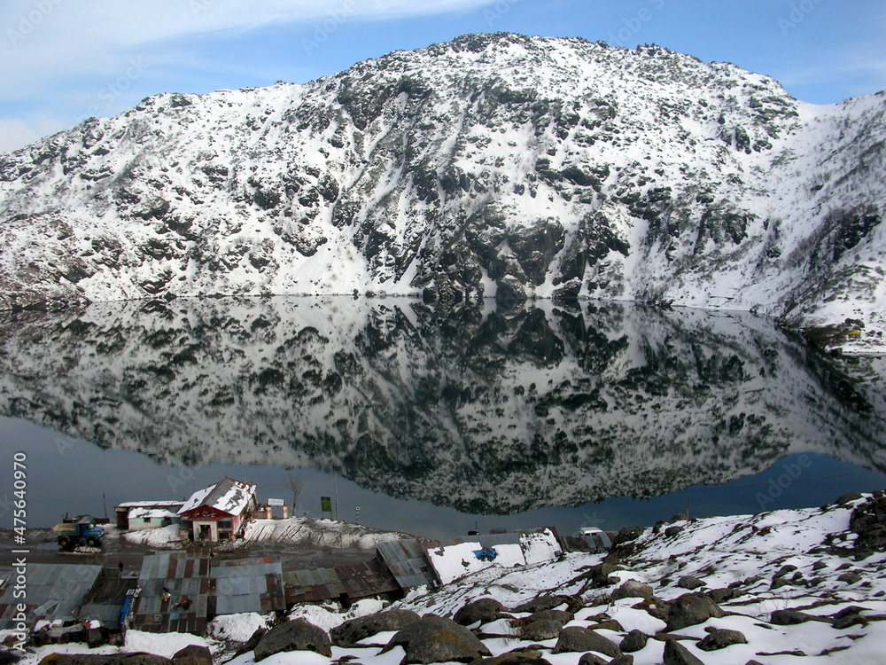 Snow covered terrain mirrored at Tsomgo Lake look mesmerizing situated ...
