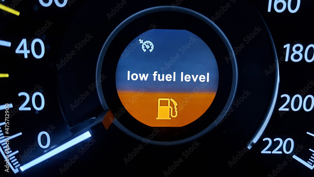 the inscription low fuel level is lit on the dashboard in the car Stock ...